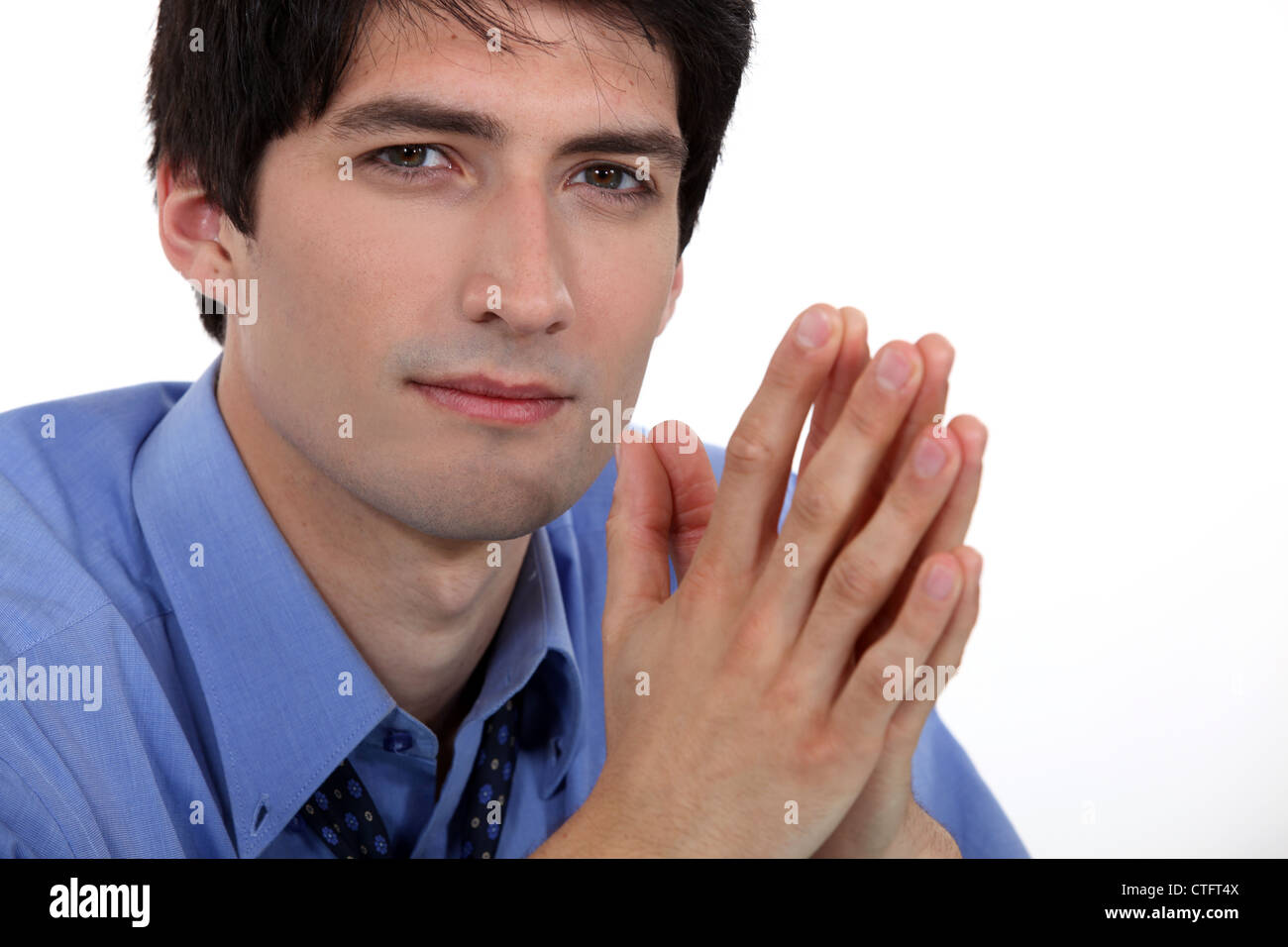 Businessman praying thoughtful young hi-res stock photography and ...