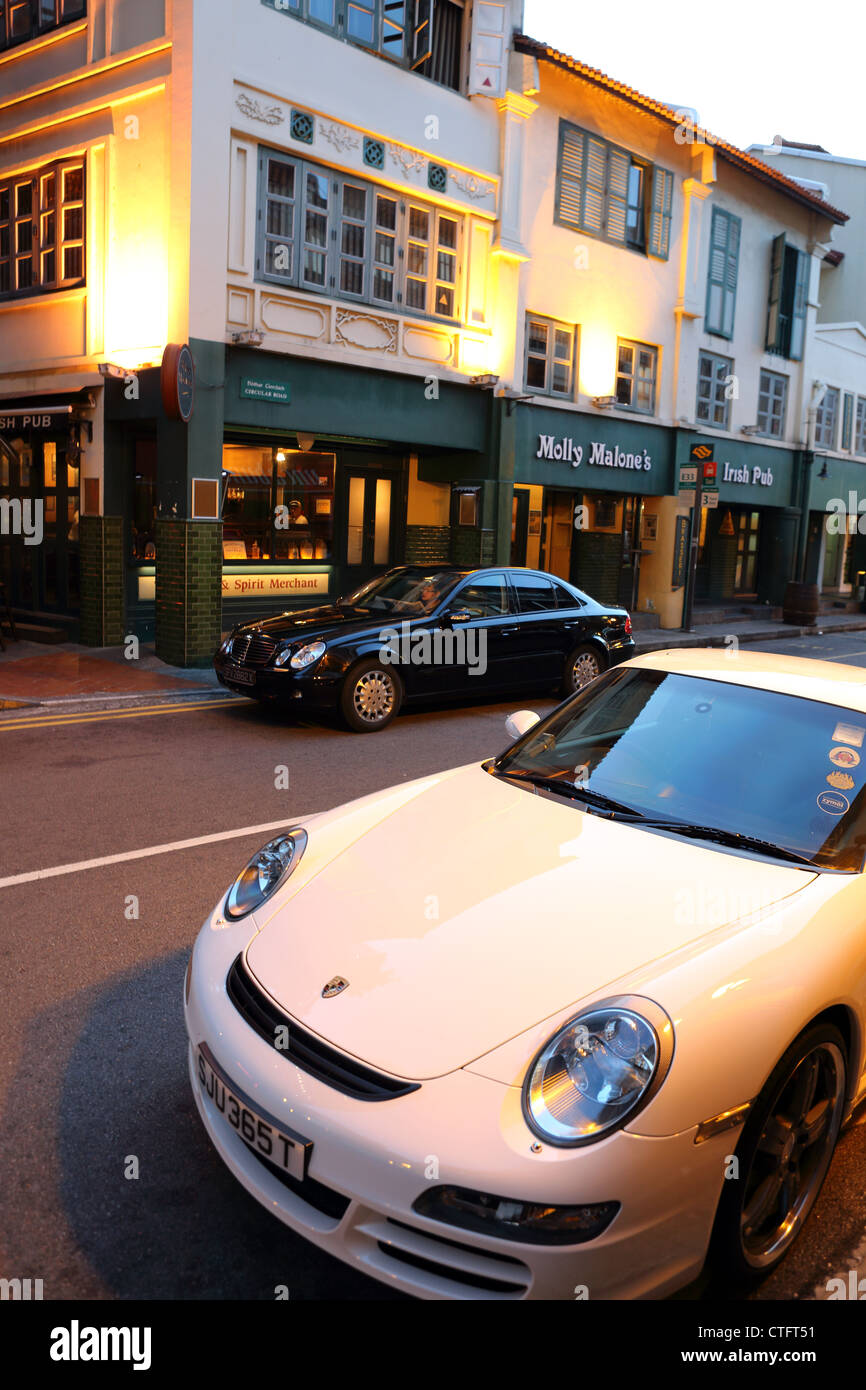 Luxury cars parked outside Molly Malone's bar near Boat Quay in ...