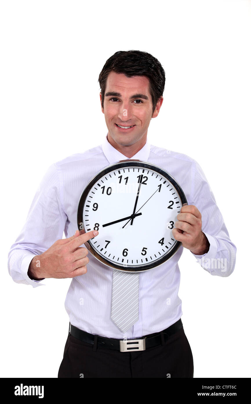 happy businessman pointing at clock Stock Photo - Alamy