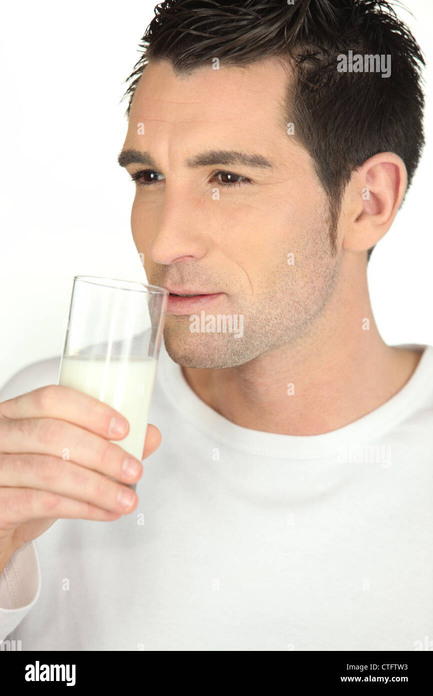 Man drinking milk on white background Stock Photo - Alamy