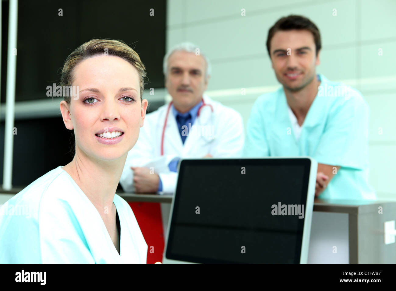 Team of three doctors Stock Photo - Alamy