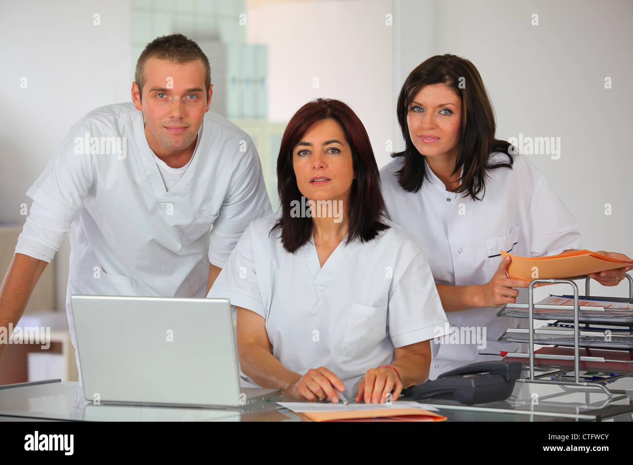 Three clinic workers Stock Photo - Alamy