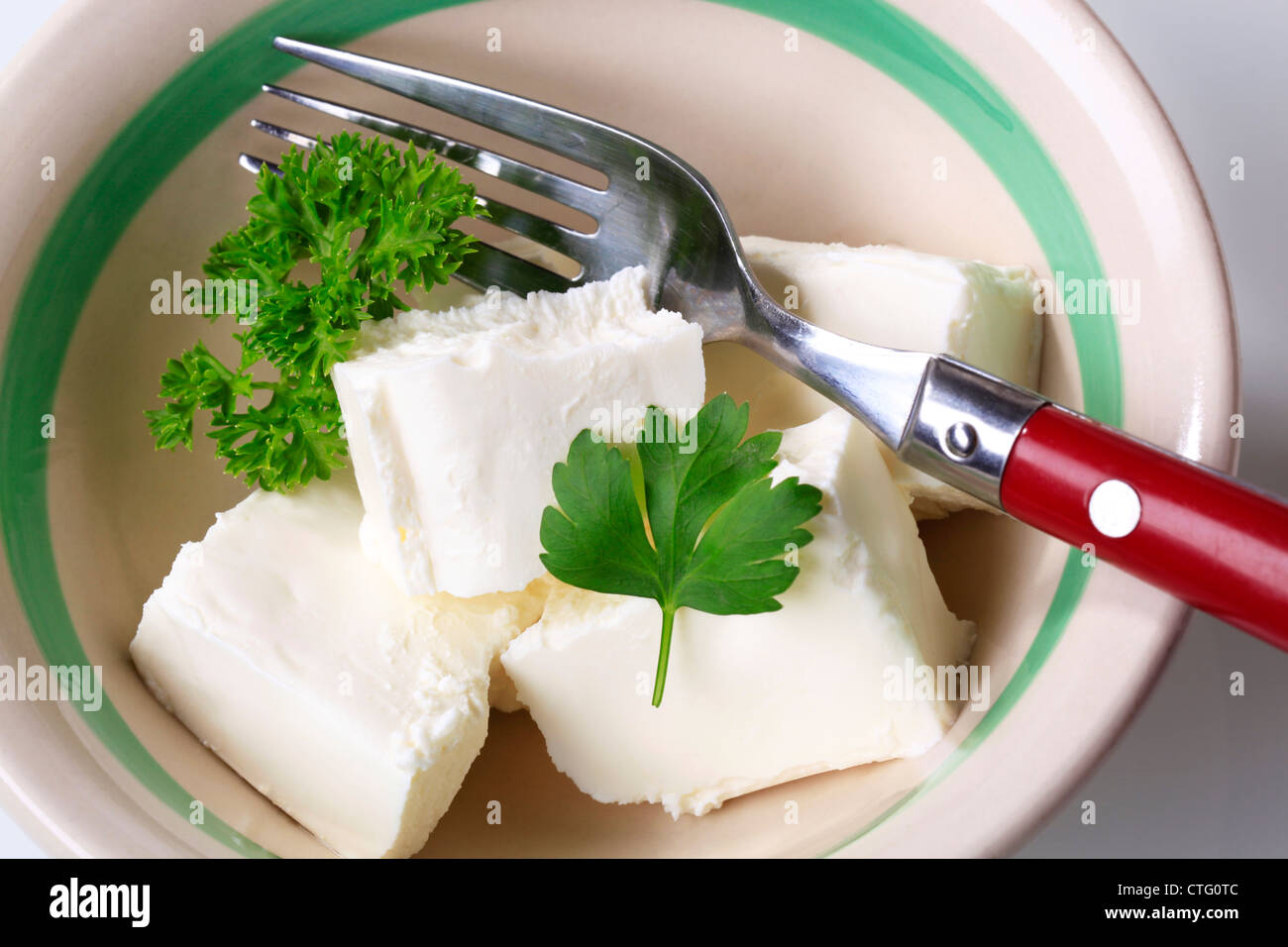 Bowl of fresh soft cheese - studio Stock Photo - Alamy