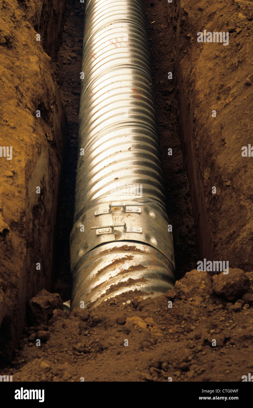 NEWLY LAID METAL PIPE IN DITCH Stock Photo - Alamy