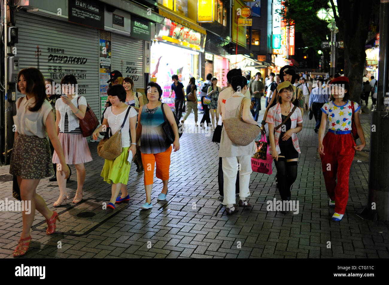 People walk along a street in central Tokyo in Japan Stock Photo - Alamy
