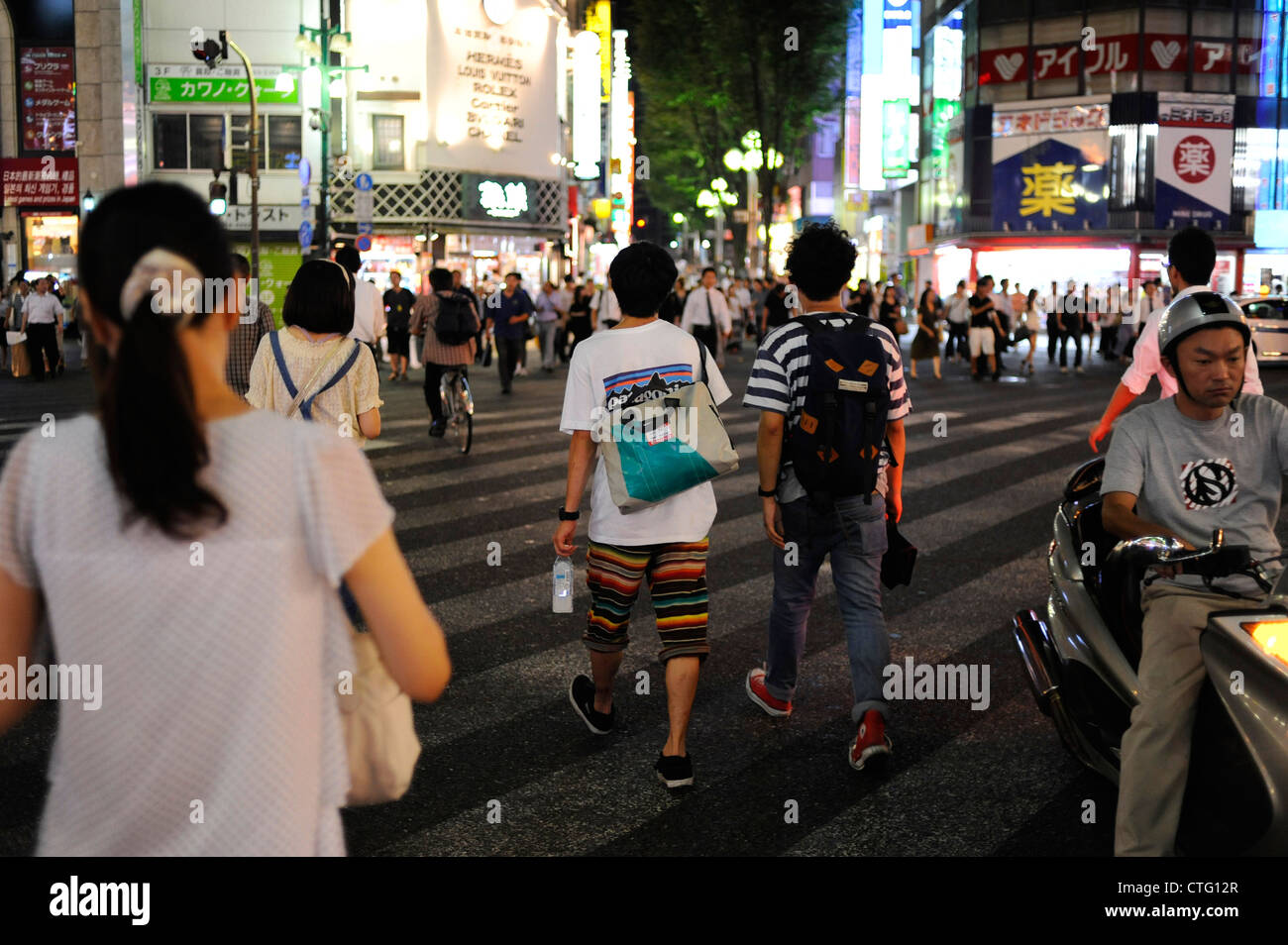 People walk along a street in central Tokyo in Japan Stock Photo - Alamy