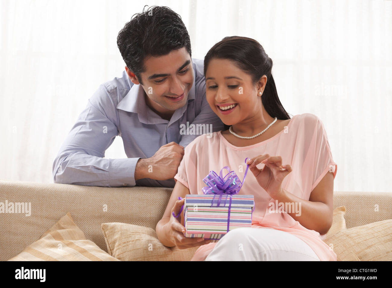 Young woman wrapping unwrapping hi-res stock photography and images - Alamy