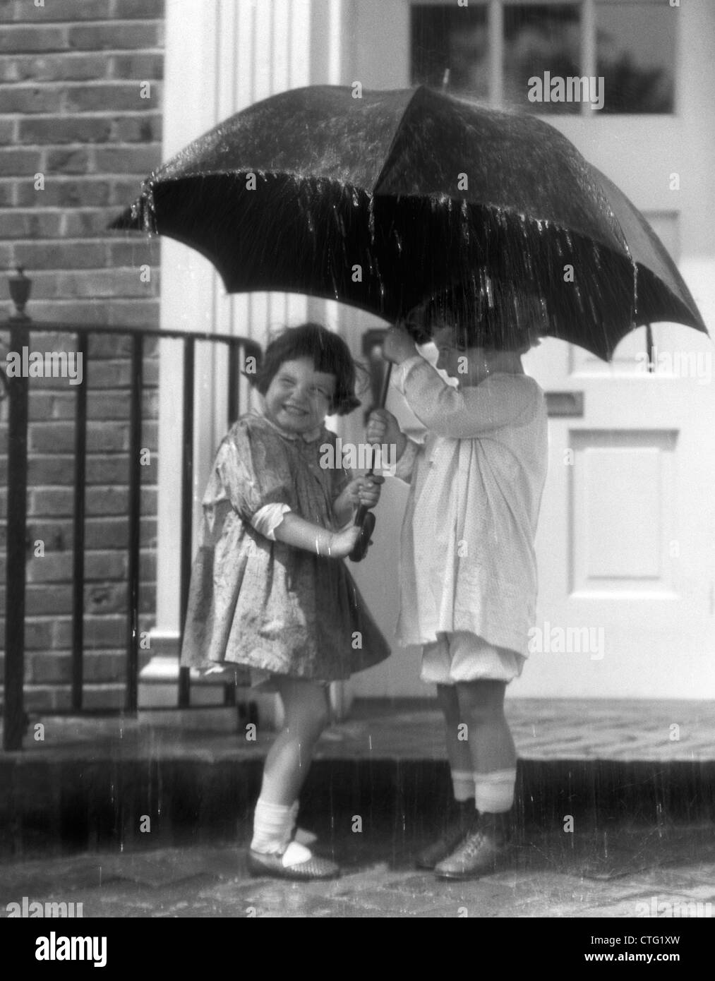 Child in wet clothes Black and White Stock Photos & Images - Alamy