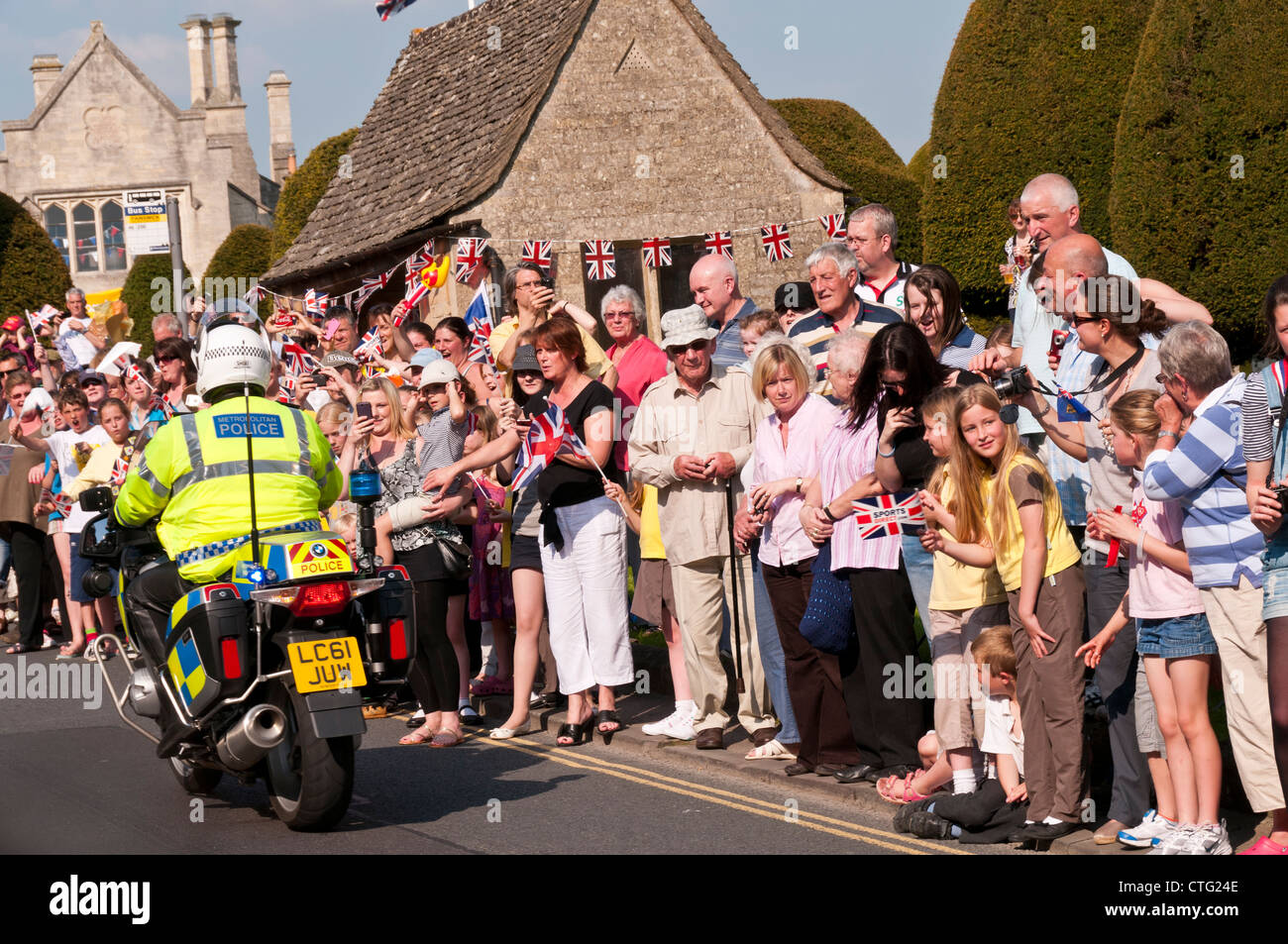 Crowd cheering with Union Jack in hand, UK Stock Photo - Alamy