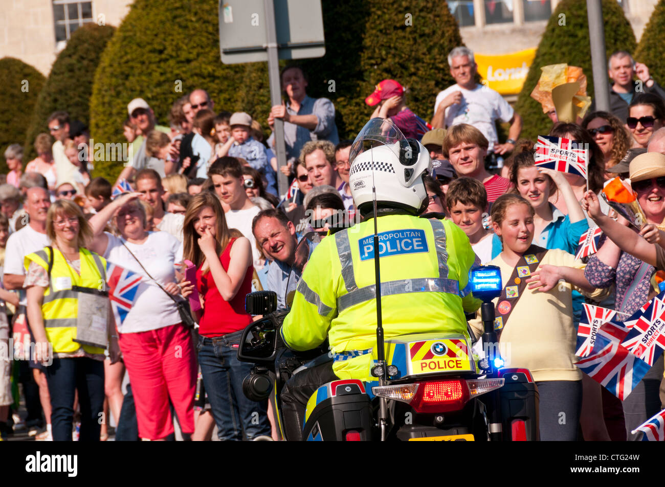 Crowd cheering with Union Jack in hand, UK Stock Photo - Alamy