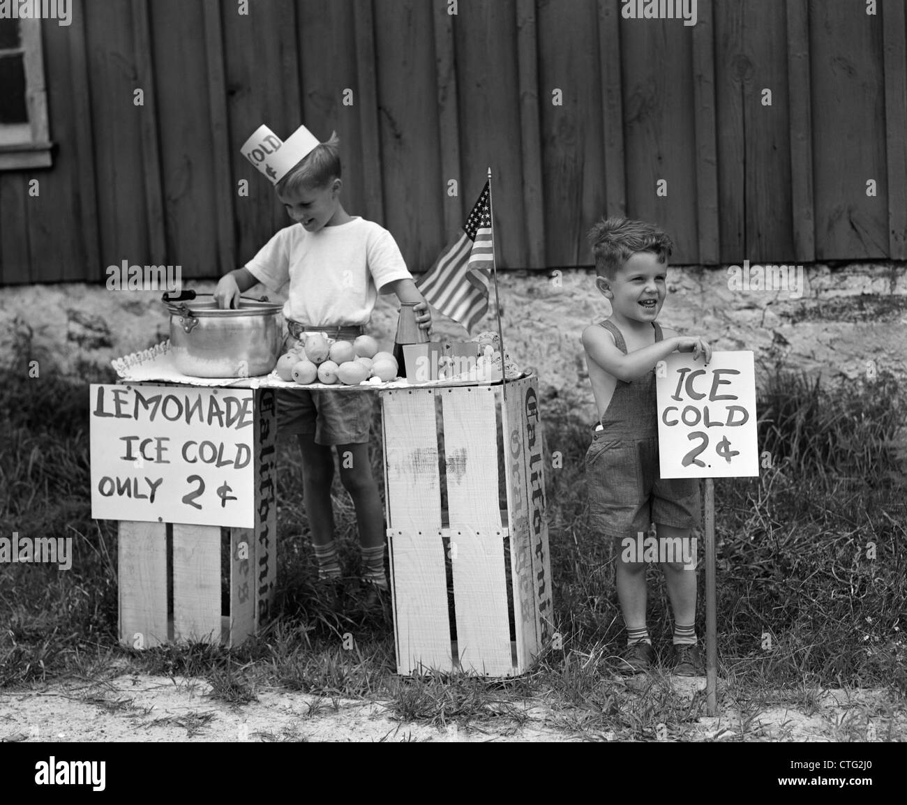 1940s TWO YOUNG BOYS SELLING FRESH LEMONADE AT STAND SUMMER Stock Photo ...
