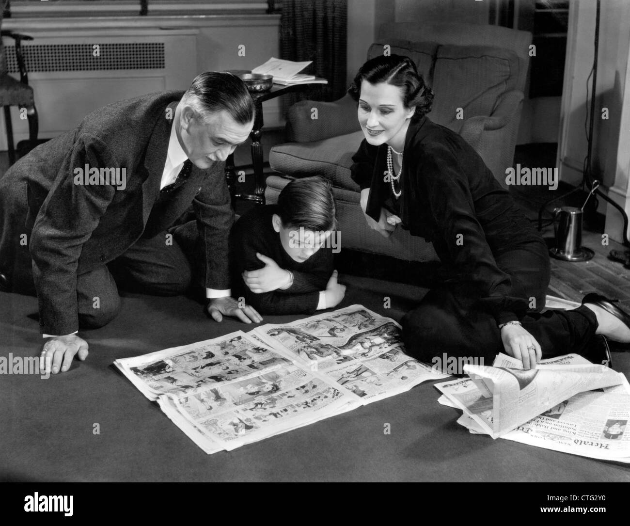 1930s 1940s FATHER AND MOTHER READING SUNDAY NEWSPAPER COMICS WITH SON ...