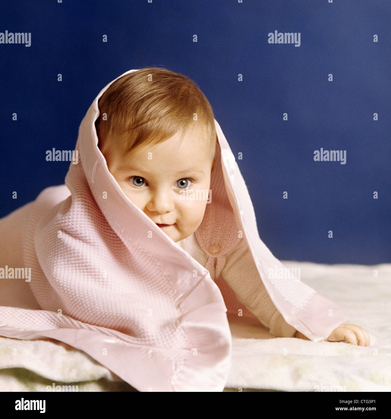 Baby peeking out from under hi-res stock photography and images - Alamy