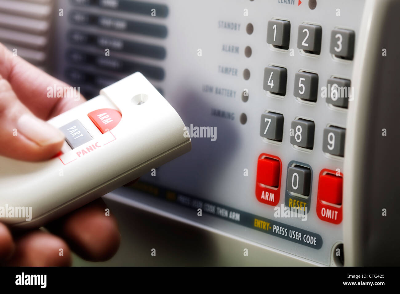 Photo of hand held panic alarm button and security panel Stock Photo ...