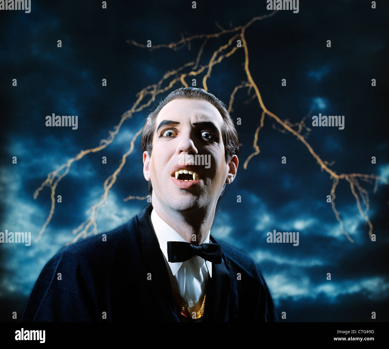 1970s DRACULA VAMPIRE CHARACTER LOOKING AT CAMERA WITH LIGHTNING IN ...