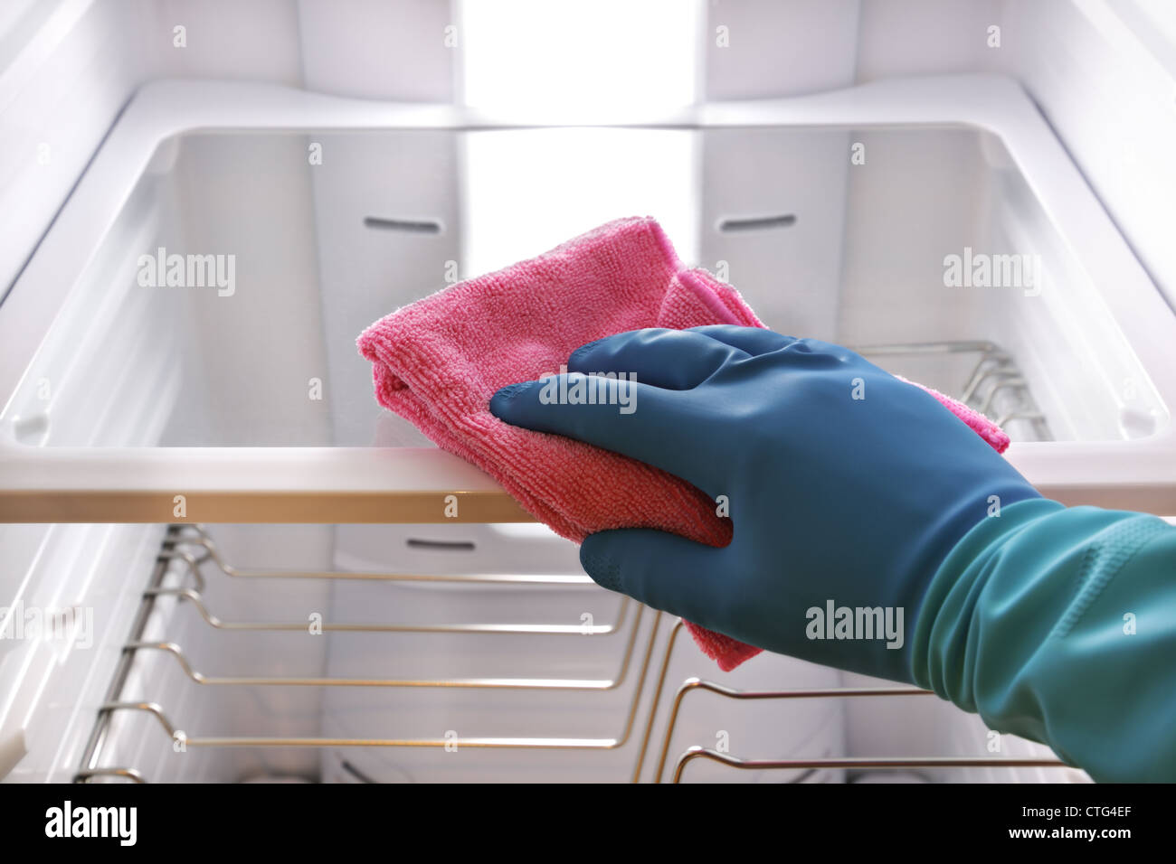 Hand cleaning refrigerator Stock Photo - Alamy