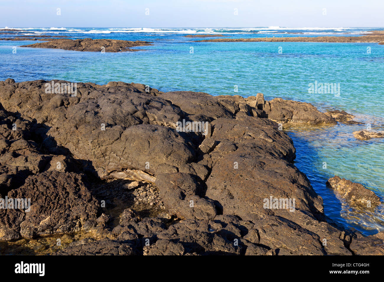 Hardened lava on the shore of volcanic island Stock Photo - Alamy