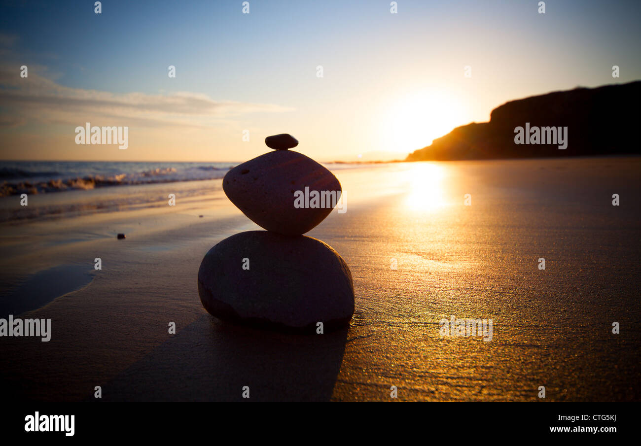 Zen Stones on the sunset beach Stock Photo - Alamy