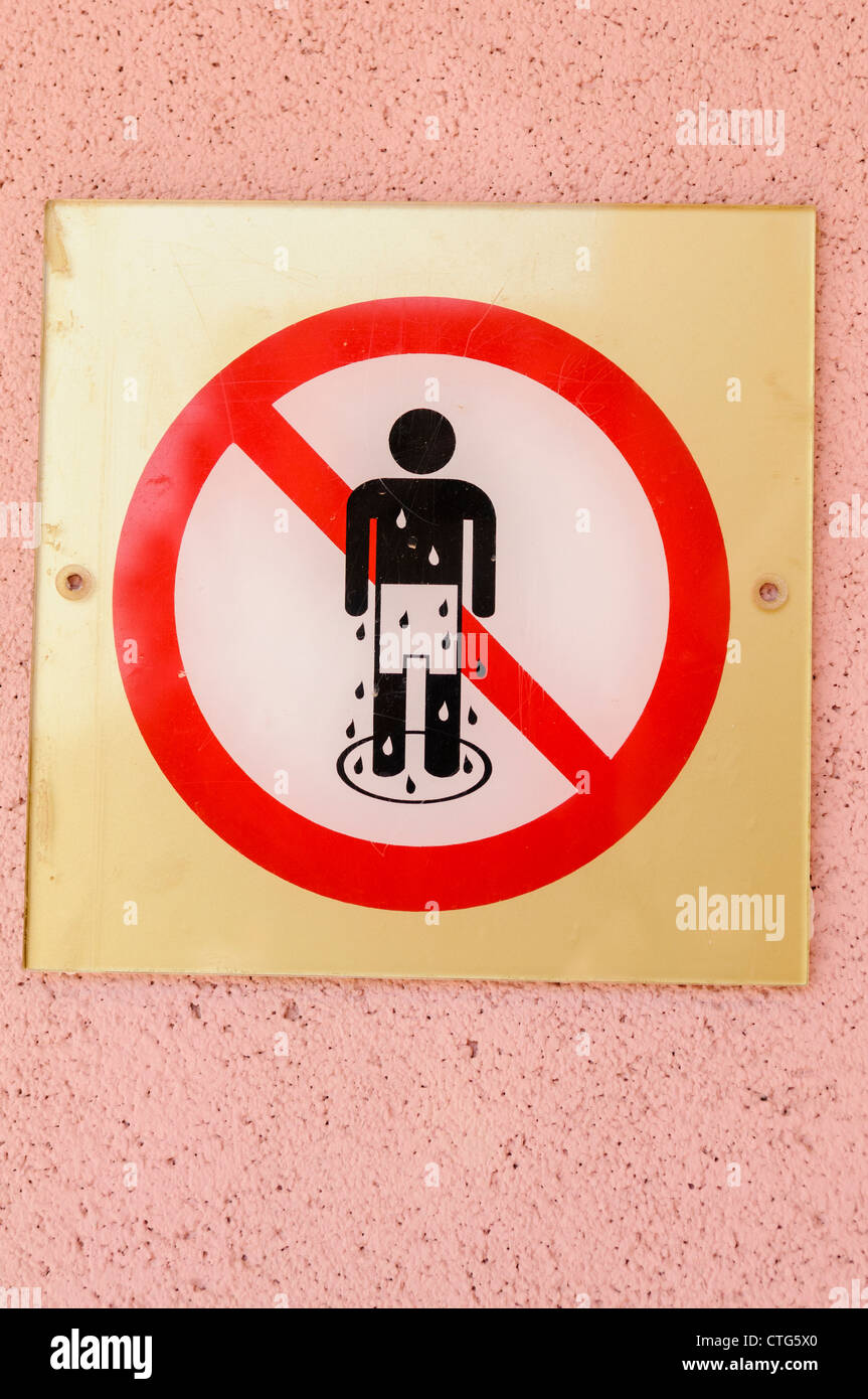 Sign at a hotel warning guests not to enter the building while wet ...