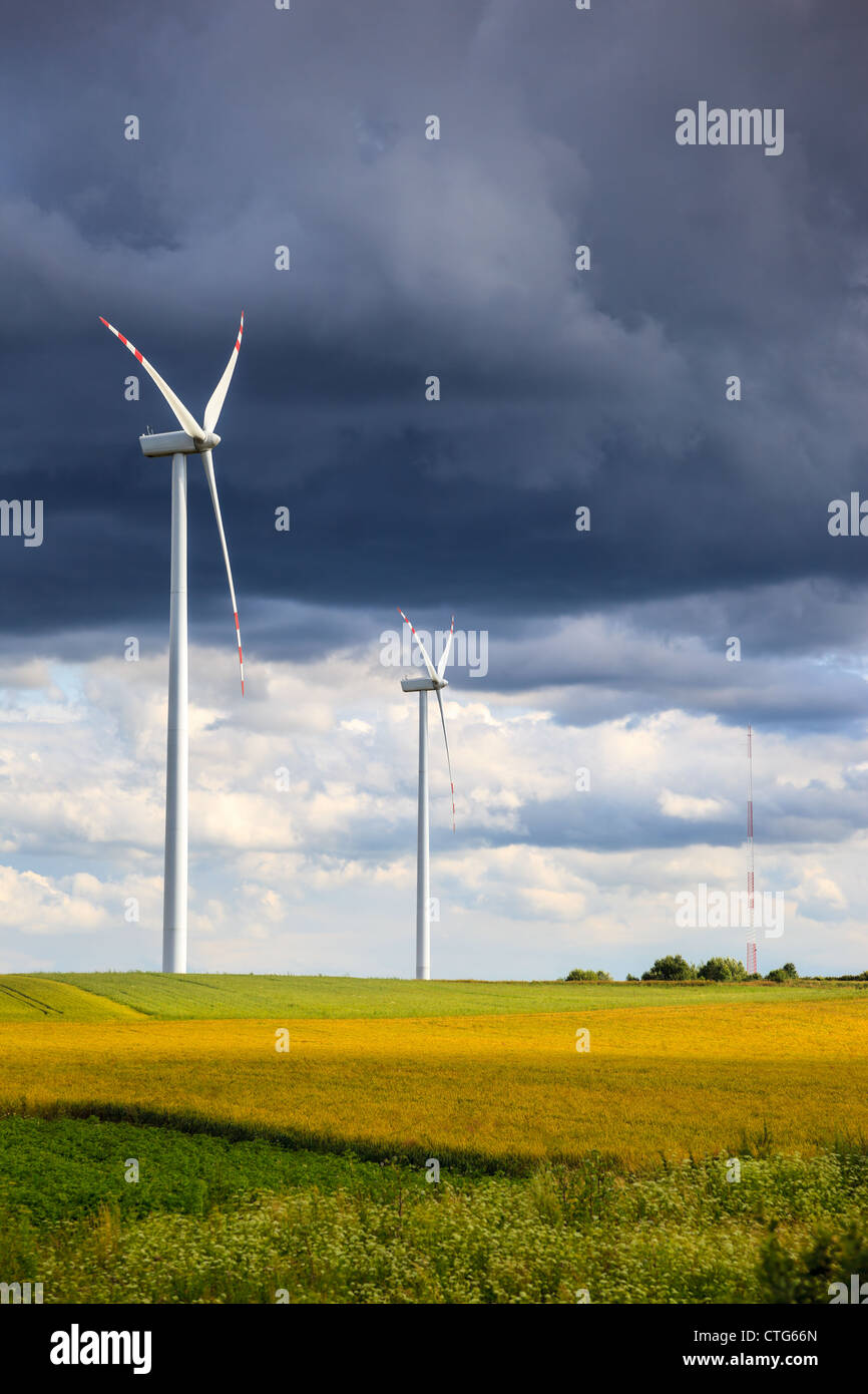 Dark rain clouds on wind power installations Stock Photo - Alamy