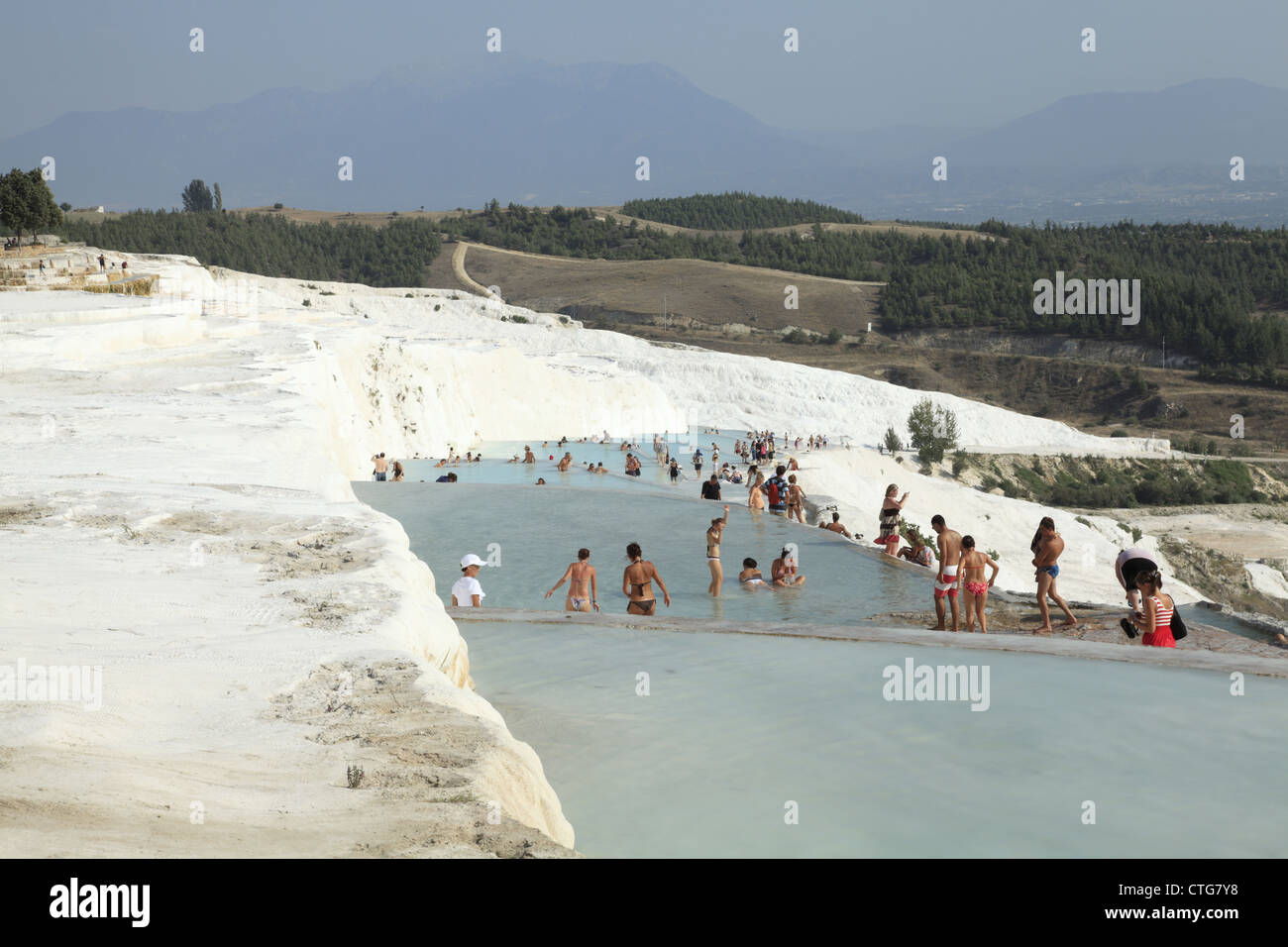 People swimming and bathing in the hot springs at Pamukkale in Turkey ...