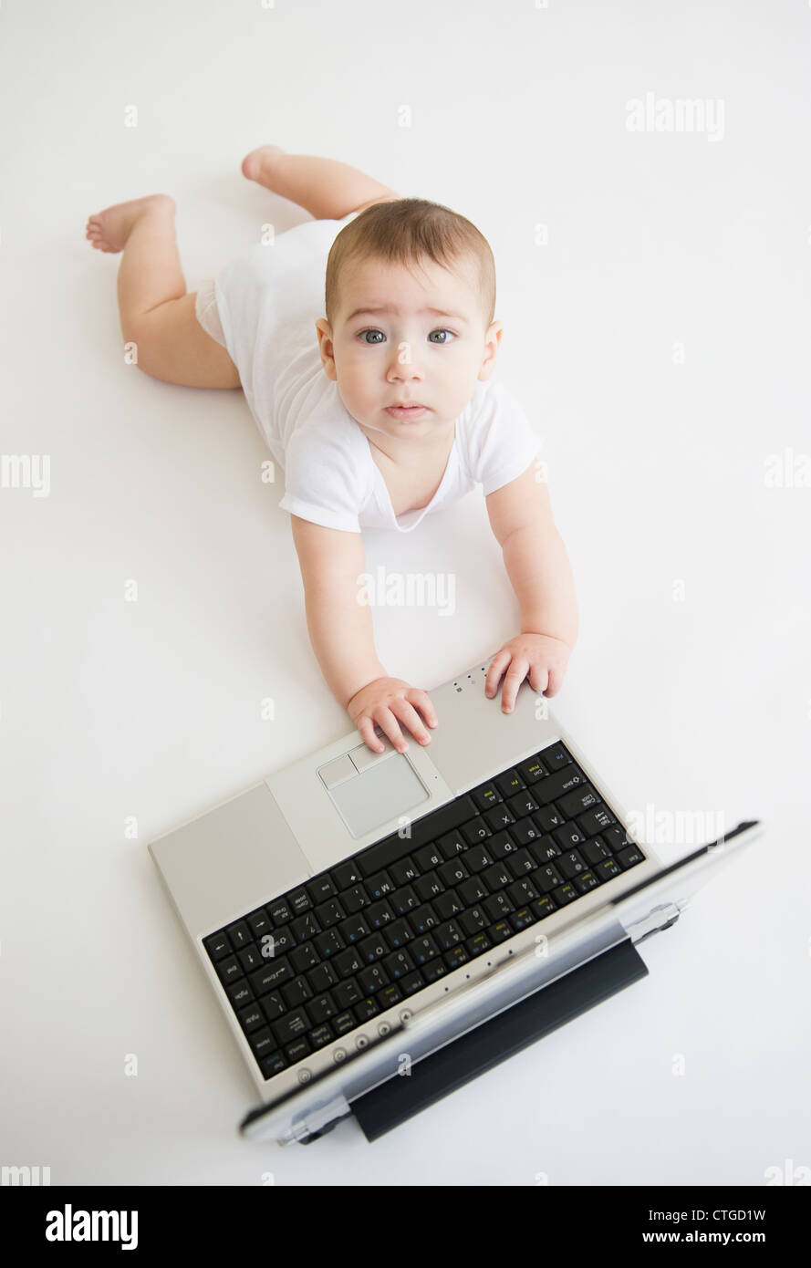 Barefoot boy with laptop hi-res stock photography and images - Alamy