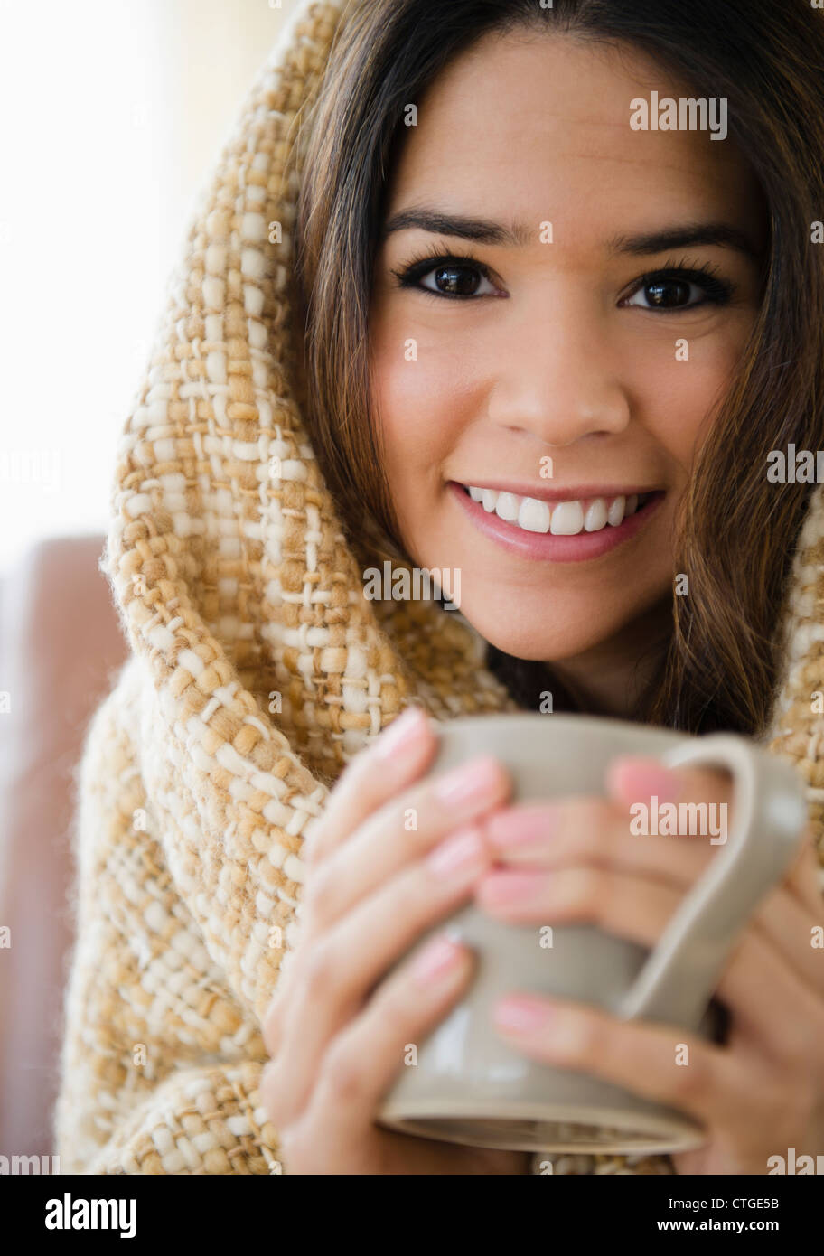 Hispanic woman drinking coffee Stock Photo - Alamy