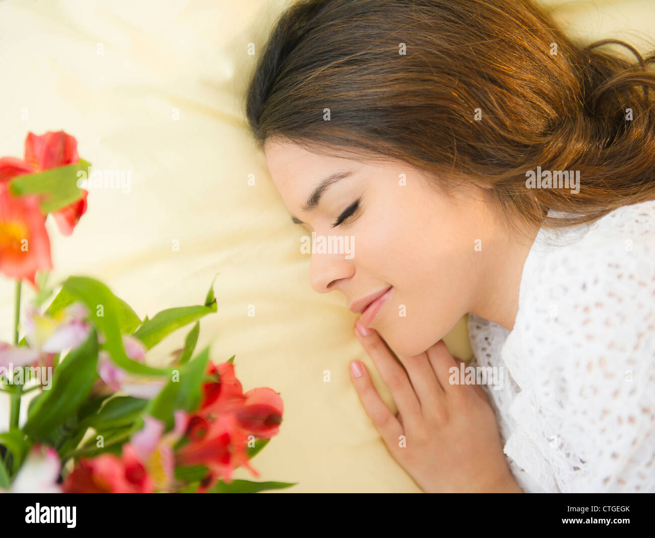 Hispanic woman sleeping in bed hi-res stock photography and images - Alamy