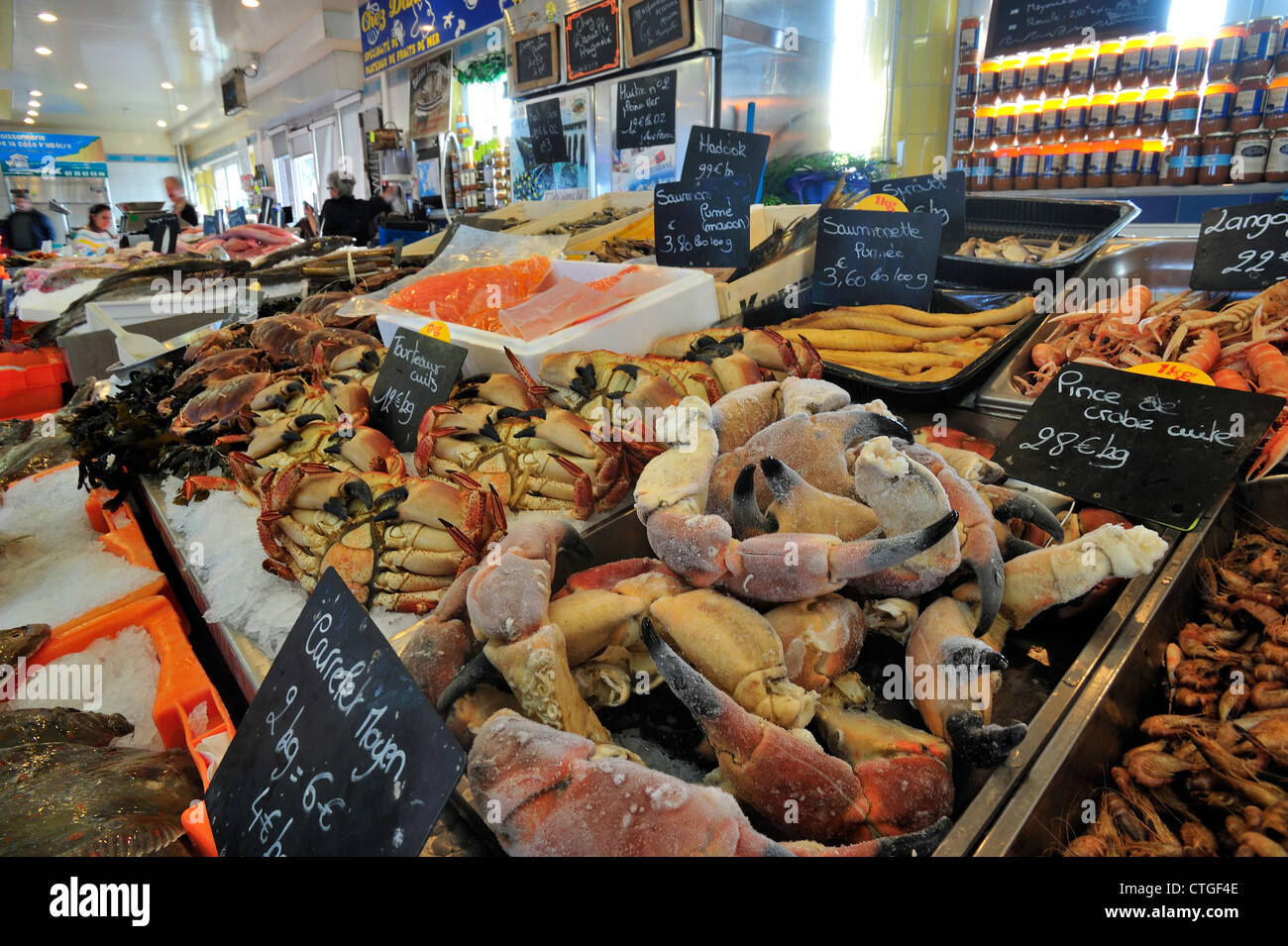 Fresh crabs and seafood on display at indoor fish market in the port of ...