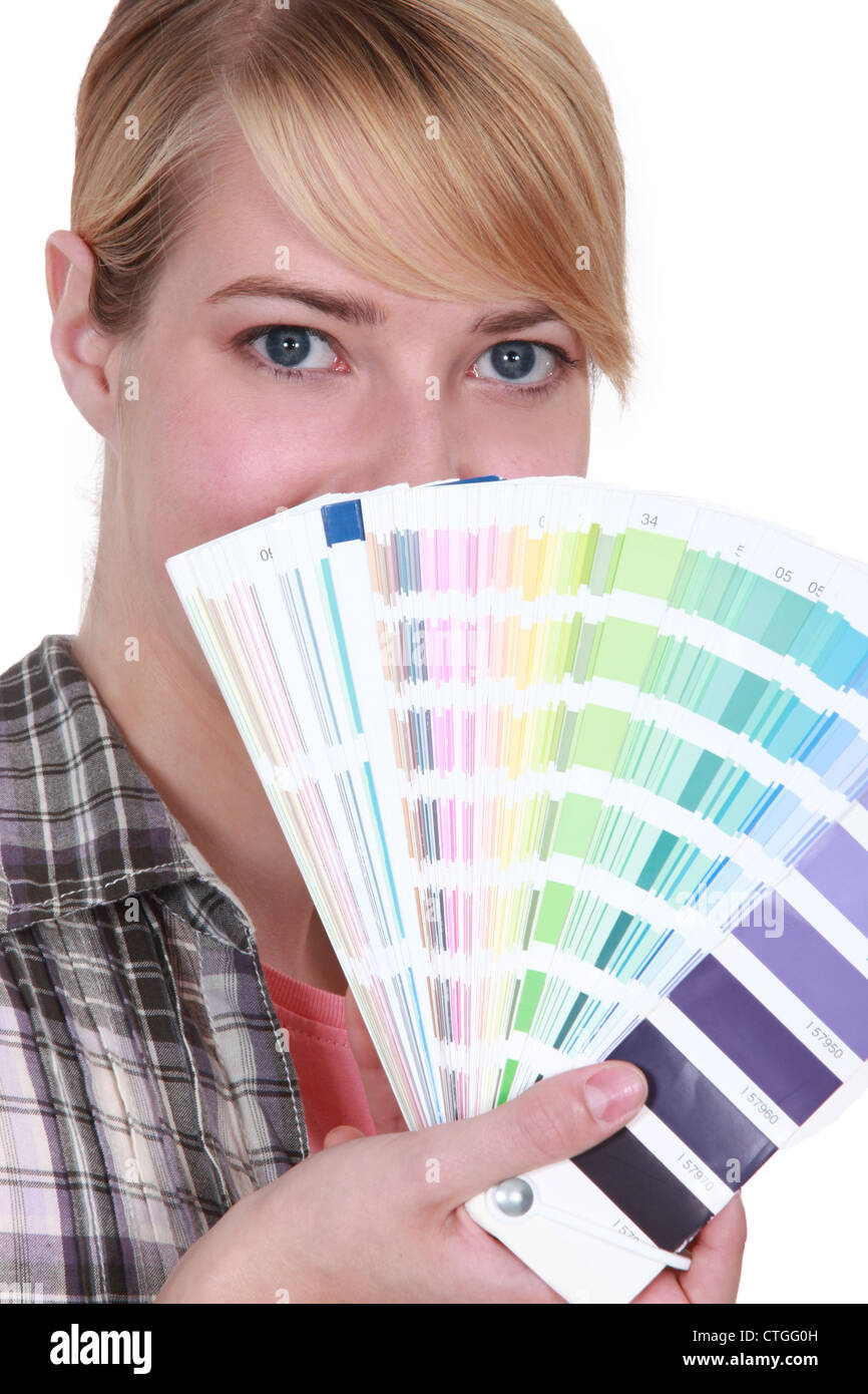 Woman picking paint swatch hi-res stock photography and images - Alamy