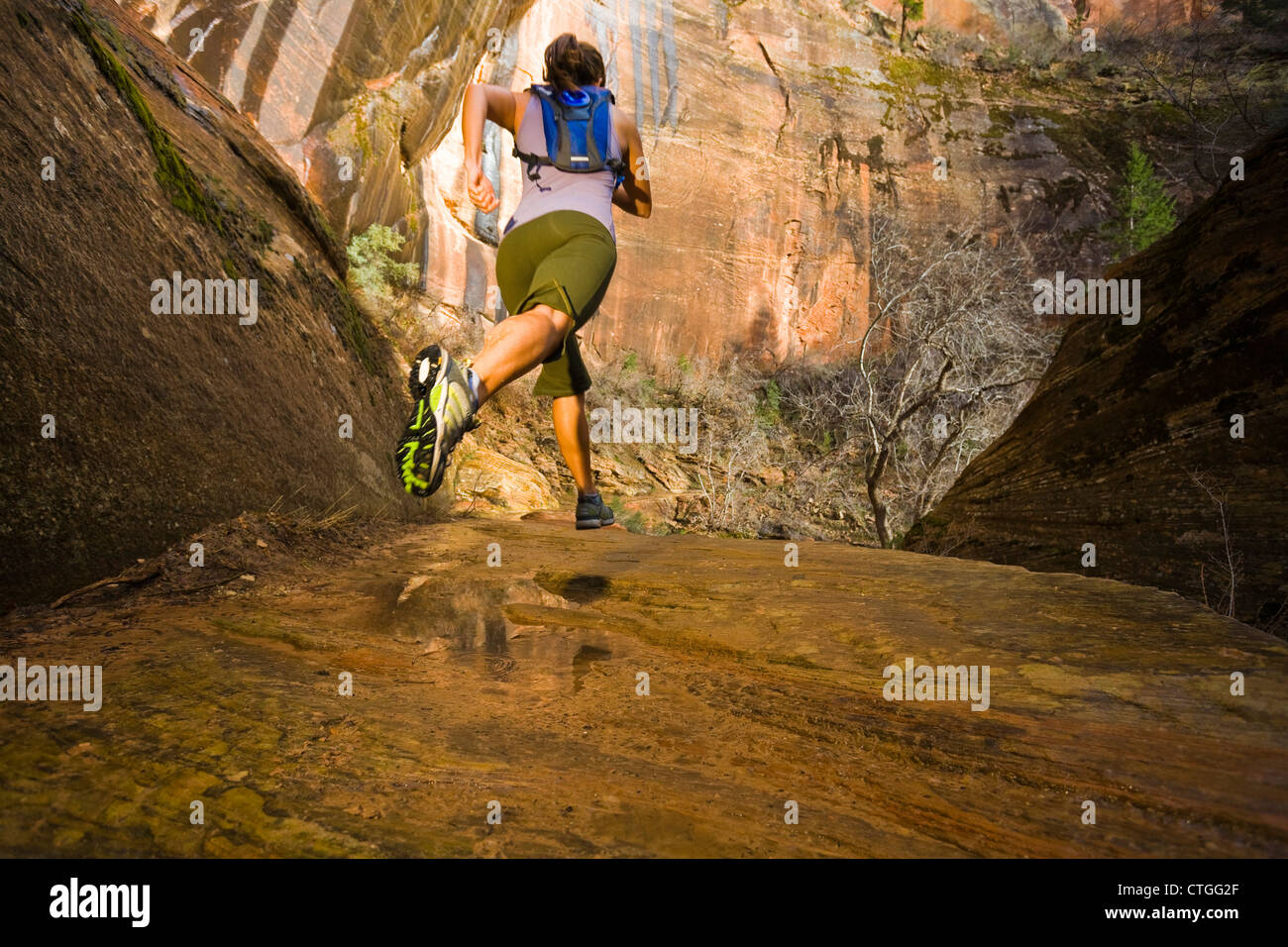 Persian woman running in a remote area Stock Photo - Alamy