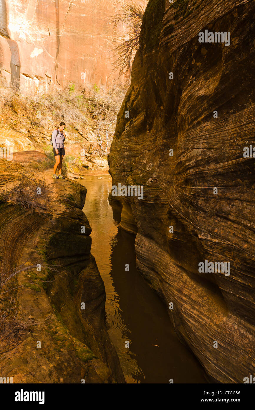 Persian woman hiking near canyon stream Stock Photo - Alamy