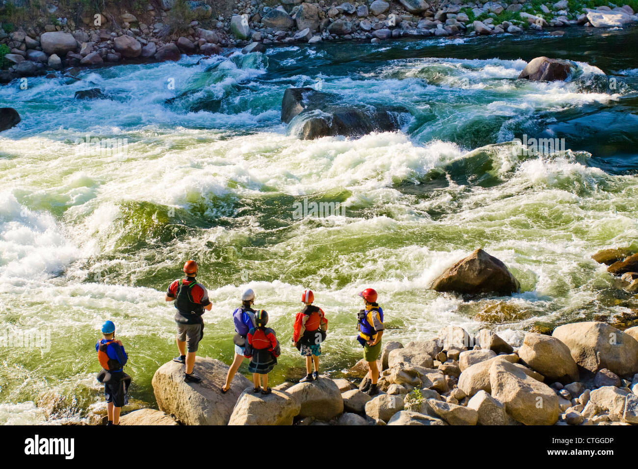 Caucasian family standing near rapids in river Stock Photo - Alamy