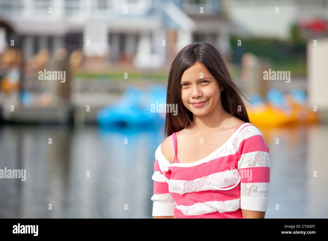 Teenage Girl On Lakeshore Of Residential Lake; Edmonton, Alberta ...