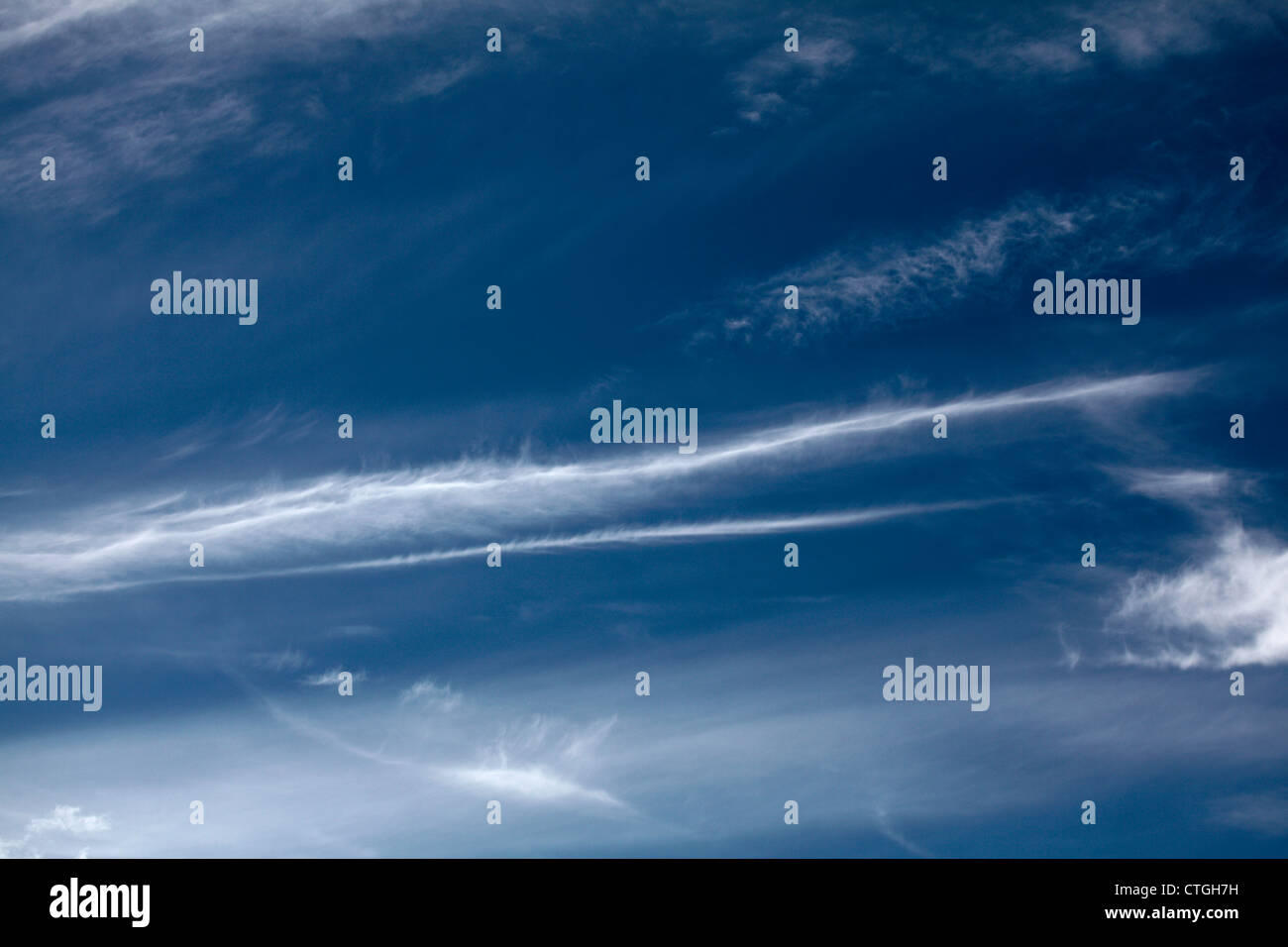 Cirrus clouds and contrails Stock Photo - Alamy
