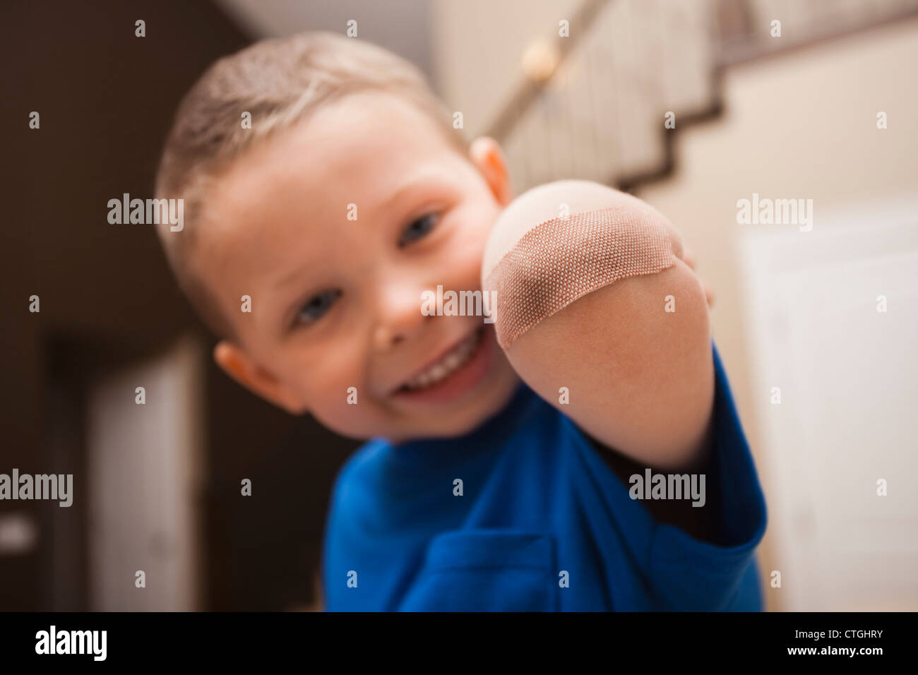 Caucasian boy with bandage on elbow Stock Photo - Alamy