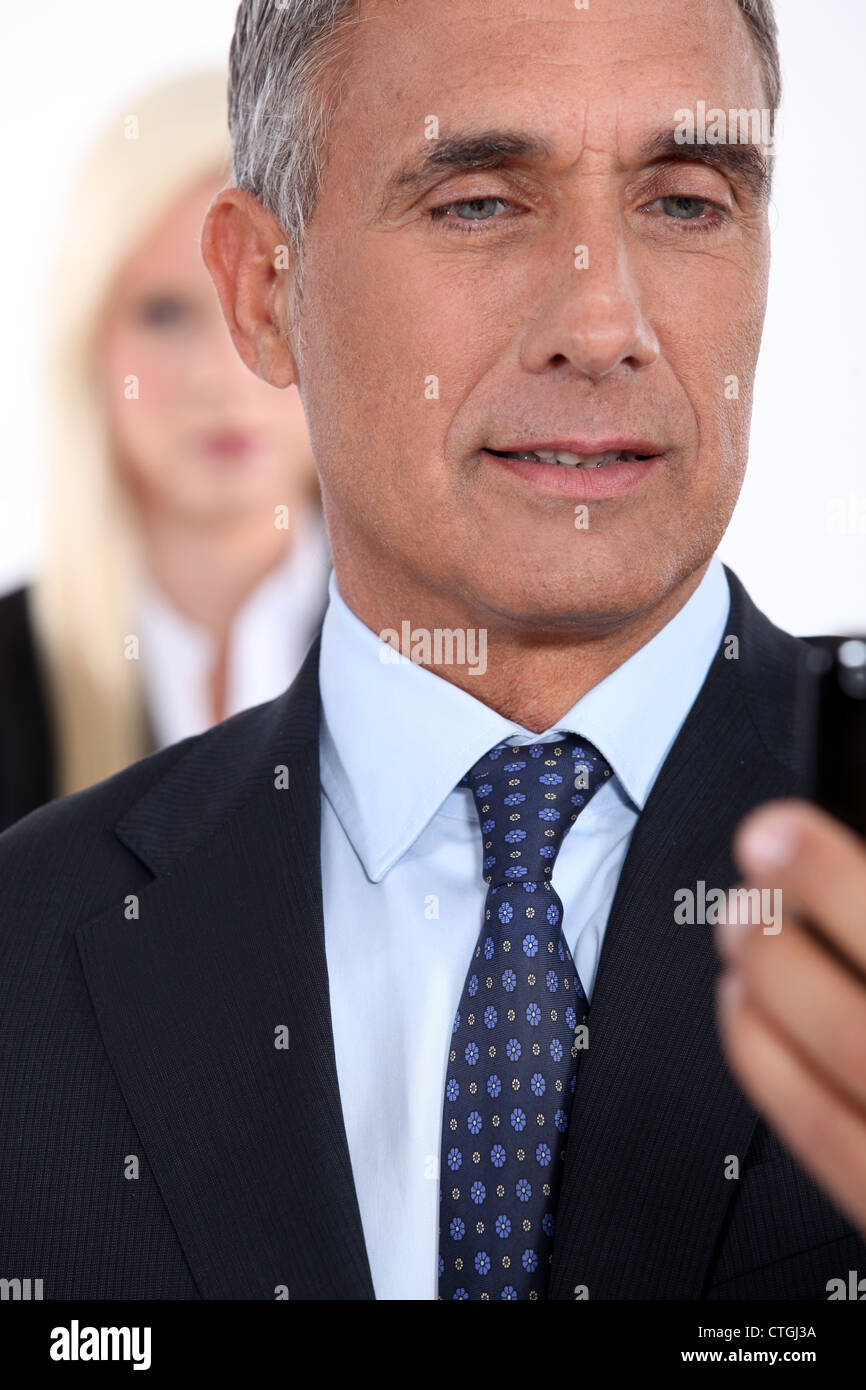 Closeup of a man watching his cellphone Stock Photo - Alamy