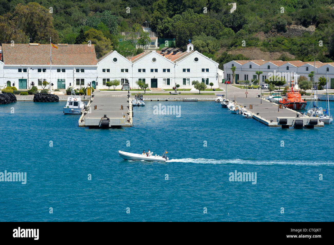 speedboat passing the old naval base mahon menorca spain Stock Photo ...