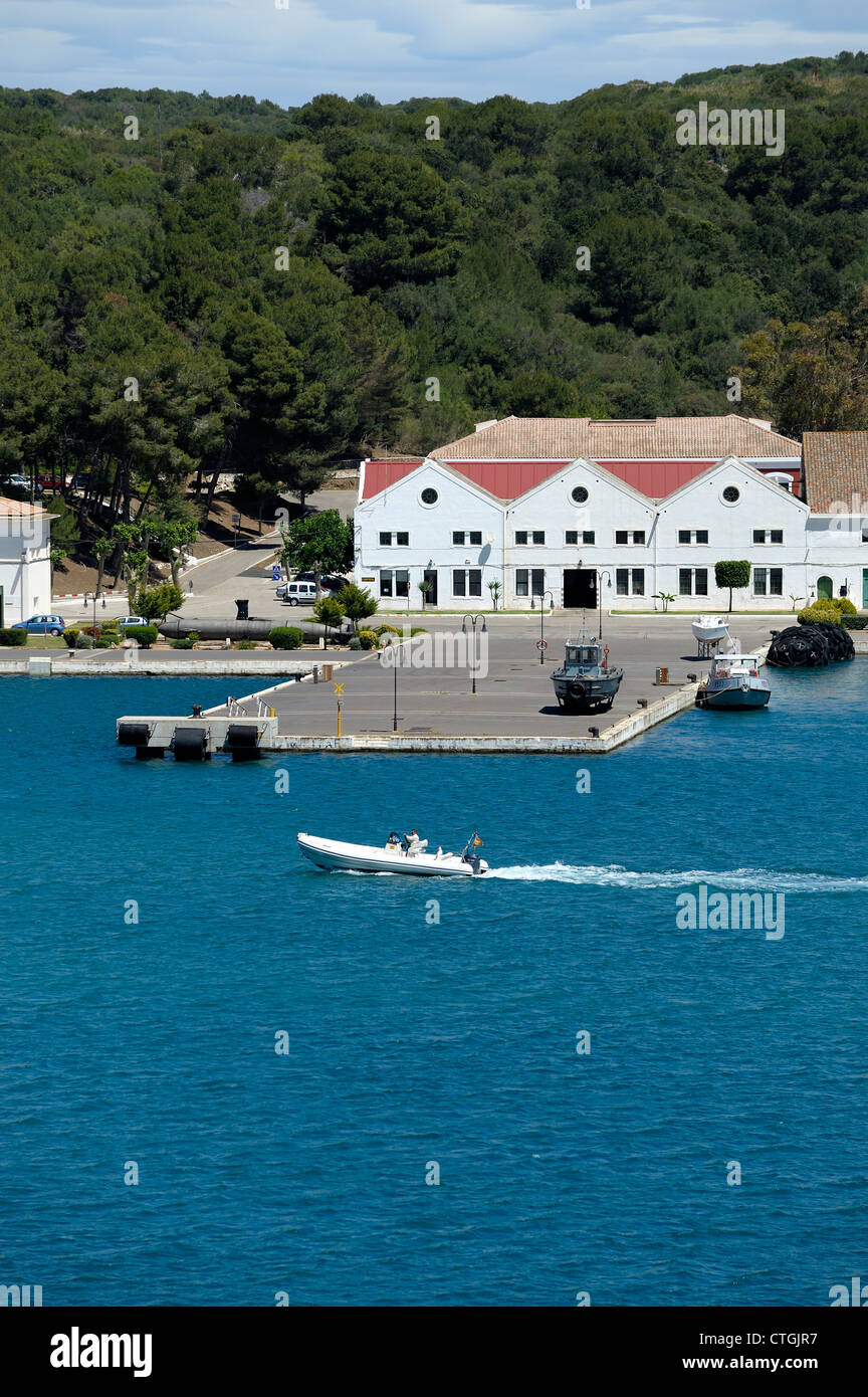 speedboat passing the old naval base mahon menorca spain Stock Photo ...