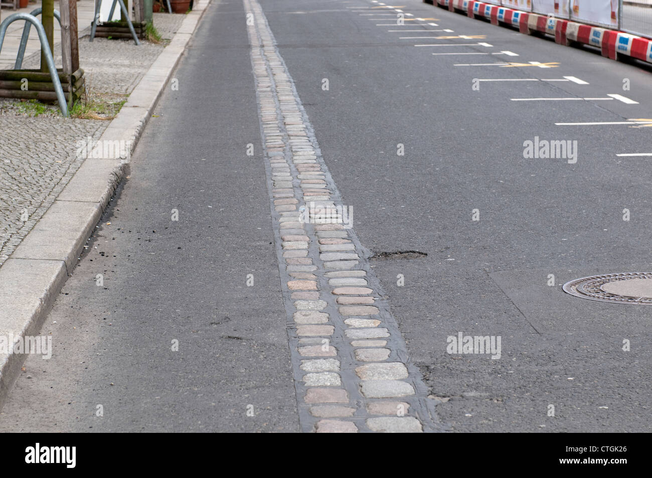 Part of line on road from Berlin Wall Stock Photo - Alamy