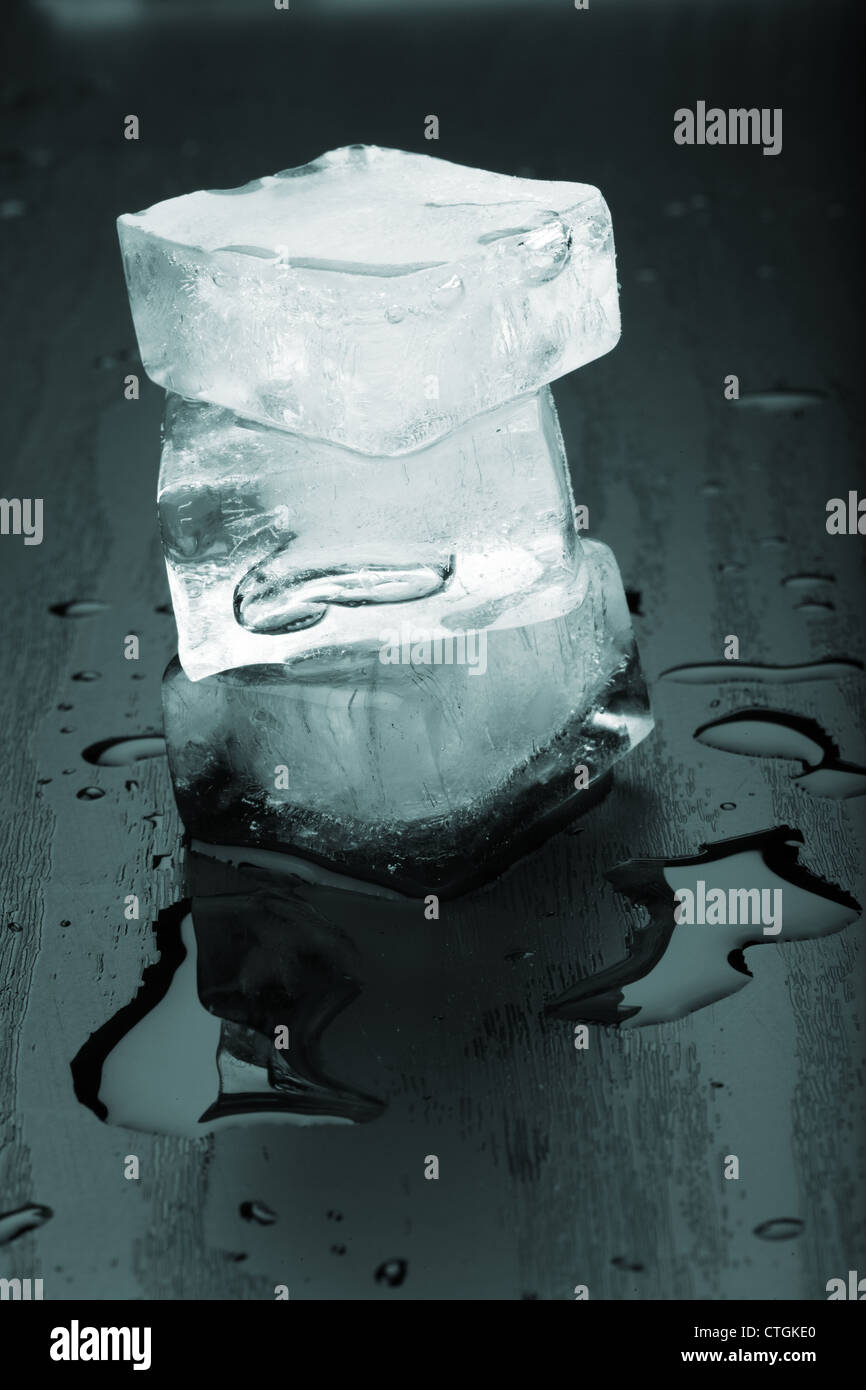 Pieces of ice cube for a cocktail on the table Stock Photo - Alamy