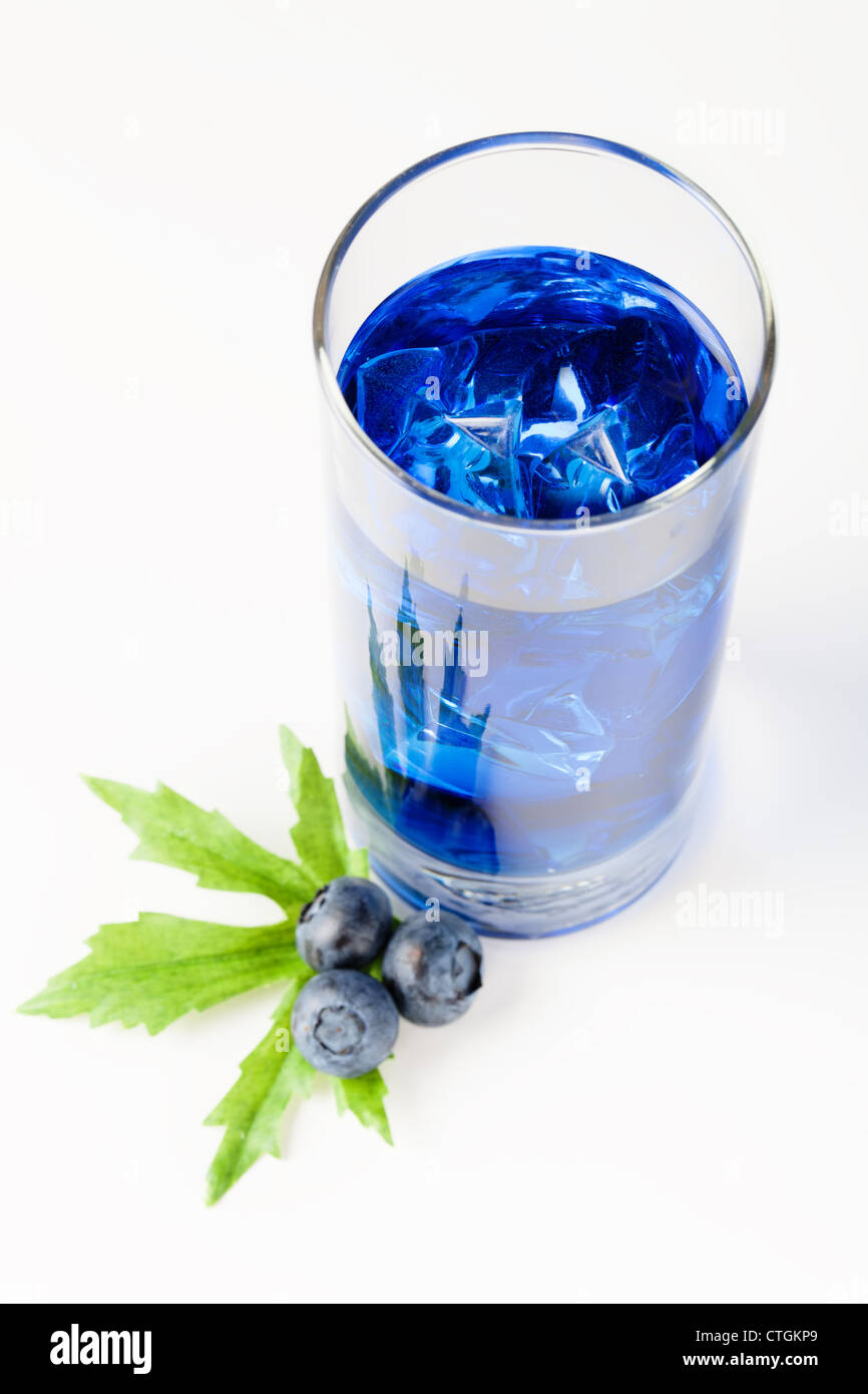 Cold blue alcohol drink cup with ice cubes Stock Photo - Alamy