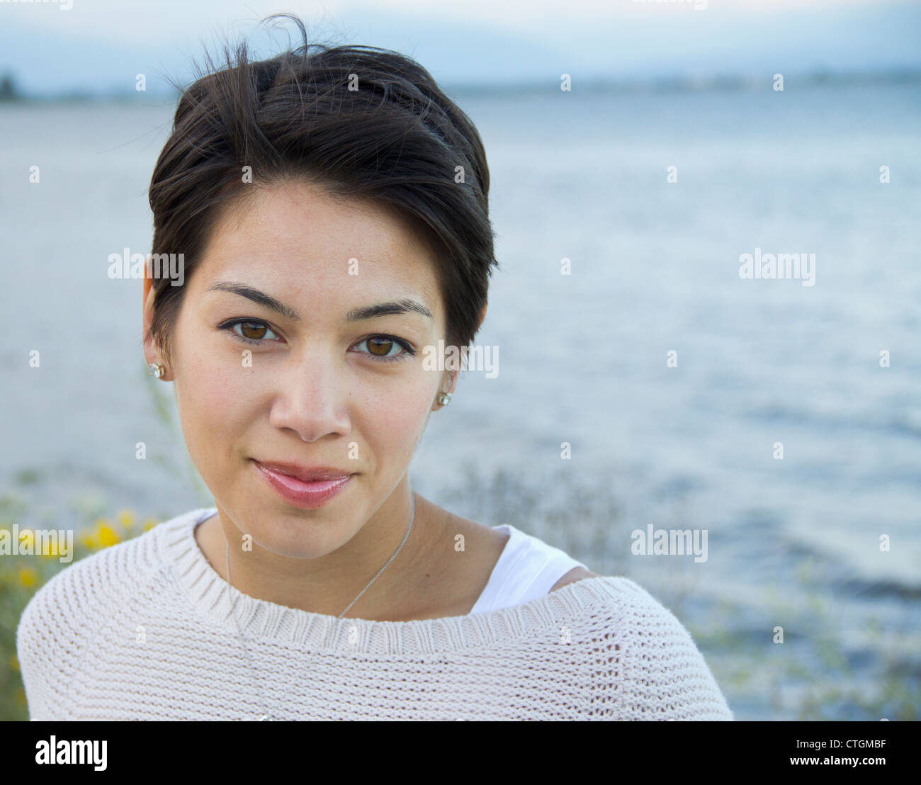 Portrait Of A Woman On The Water's Edge; Delta, British Columbia ...