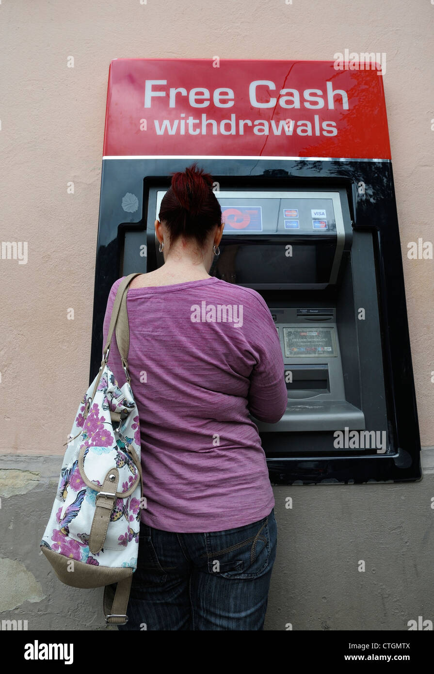 female using link cash machine with free cash withdrawals matlock ...