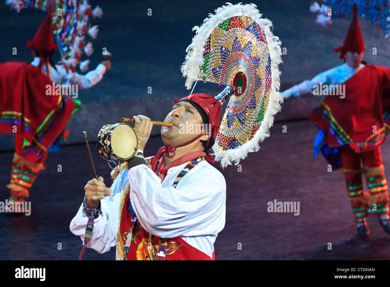 Mexican man plays flute and drum at Xcaret's "Mexico Espectacular" show ...