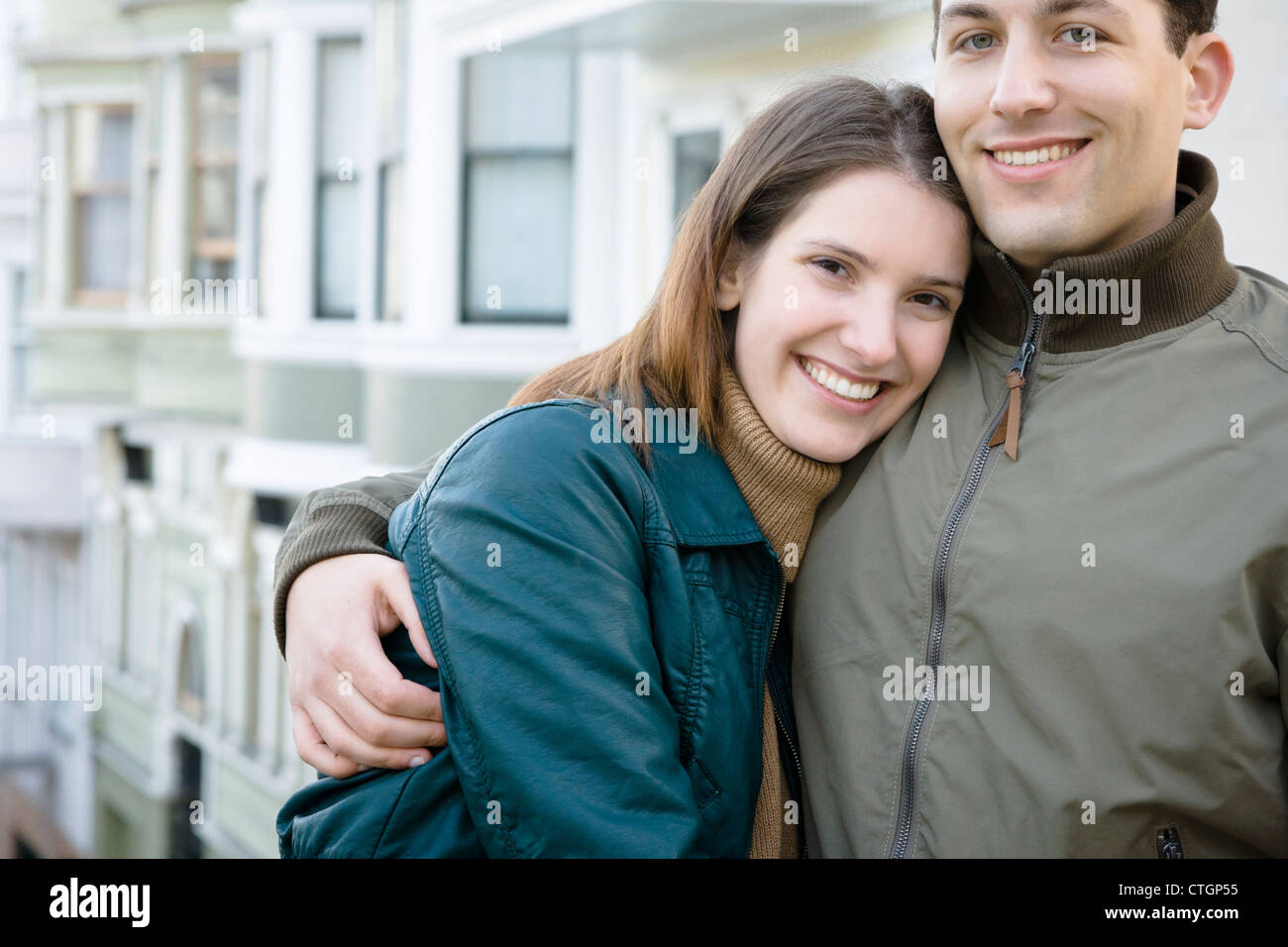 Caucasian couple hugging Stock Photo - Alamy