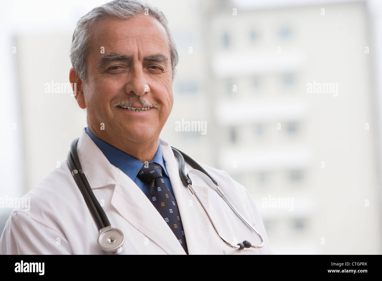 Smiling Hispanic doctor Stock Photo - Alamy
