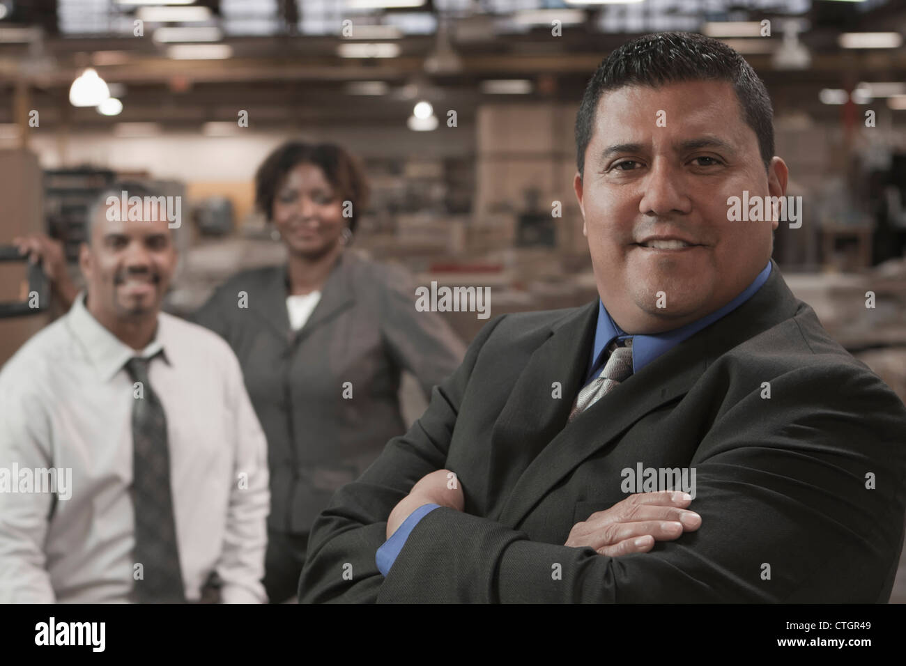 Business people standing in warehouse Stock Photo - Alamy