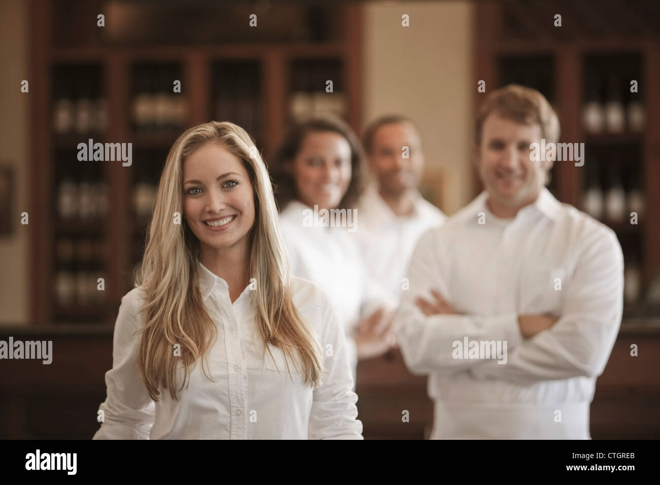 Wait staff standing in restaurant Stock Photo - Alamy