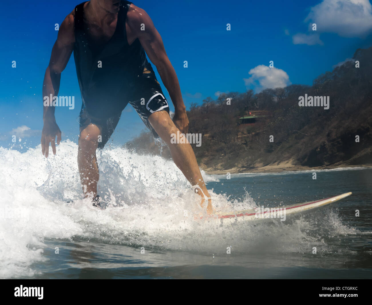 Surfer riding a wave Stock Photo - Alamy